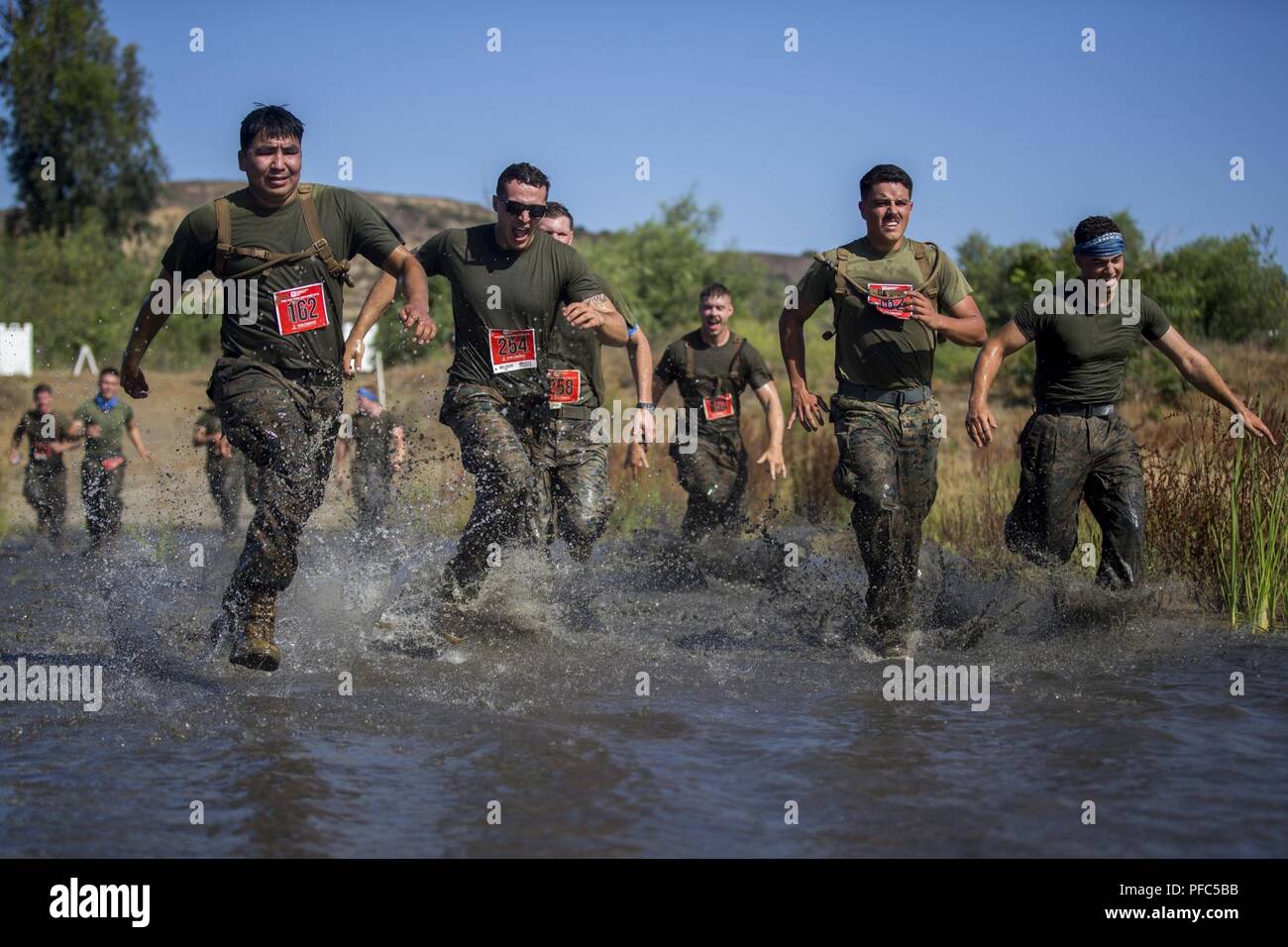 Marines run through the,“Chosin Reservoir”portion of the 2018 Mud Run ...