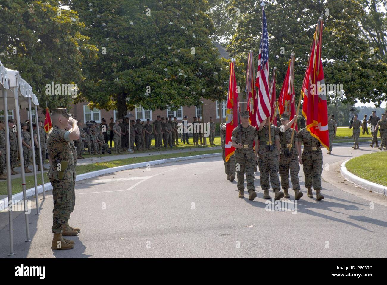 U.S. Marine Corps Col. David S. Owen and Col. Jordan D. Walzer salute ...