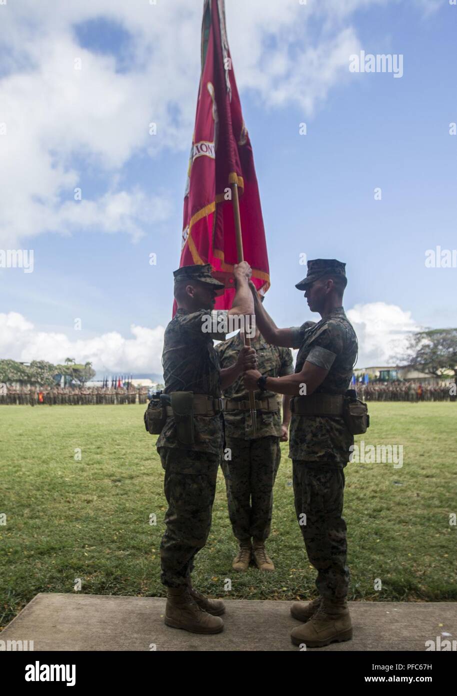 U.S. Marine Corps Lt. Col. Bolivar Pluas passes the battalion colors Lt ...