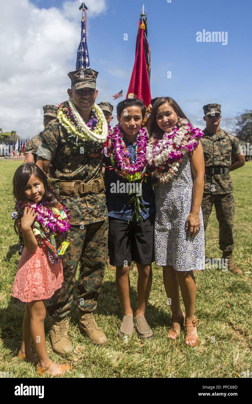 U.S. Marine Corps Lt. Col. Bolivar Pluas and his family pose for a ...