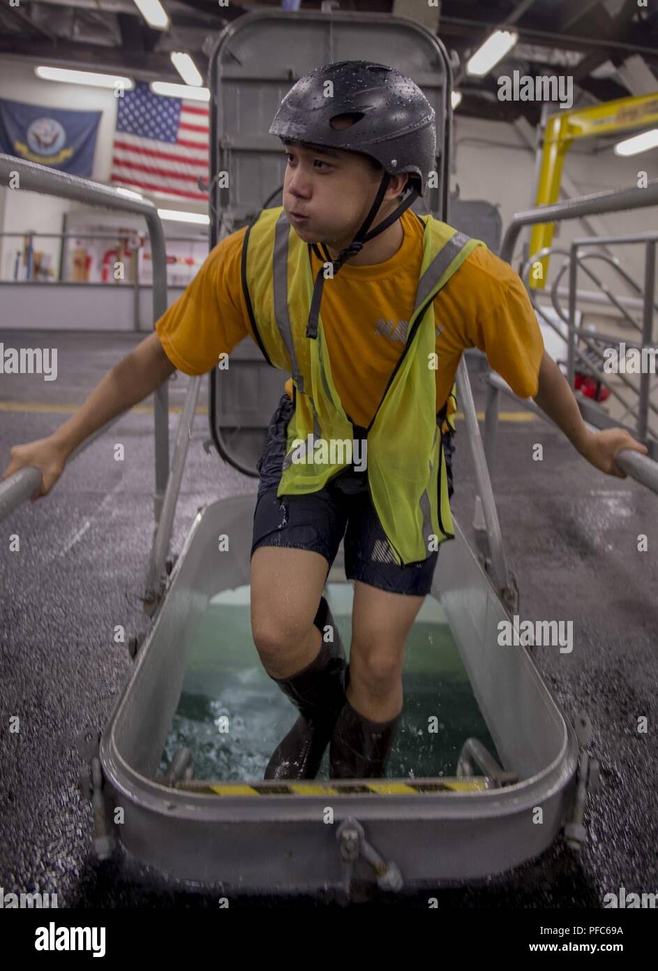R.I. (June 7, 2018) A Navy ROTC midshipman responds to a simulated ...