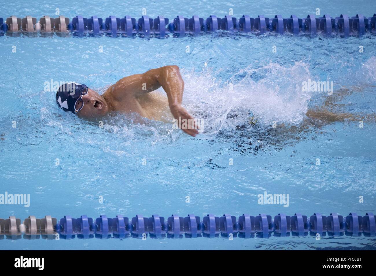 Team Navy Lt. Andrew Hoyle competes in the 100-meter freestyle event of ...