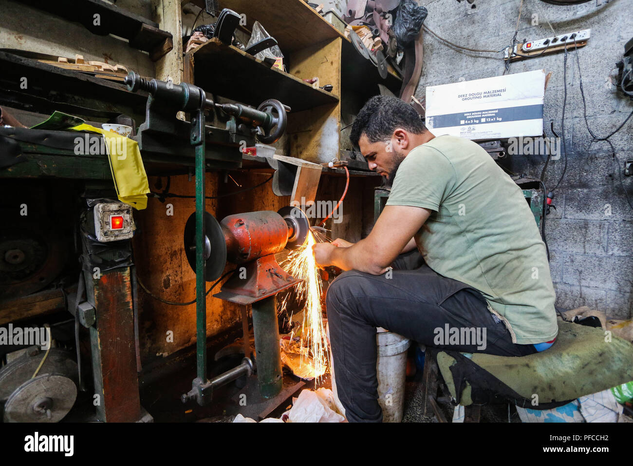 Gaza, Palestine. August 20, 2018 - Workers in a blacksmith workshop in ...
