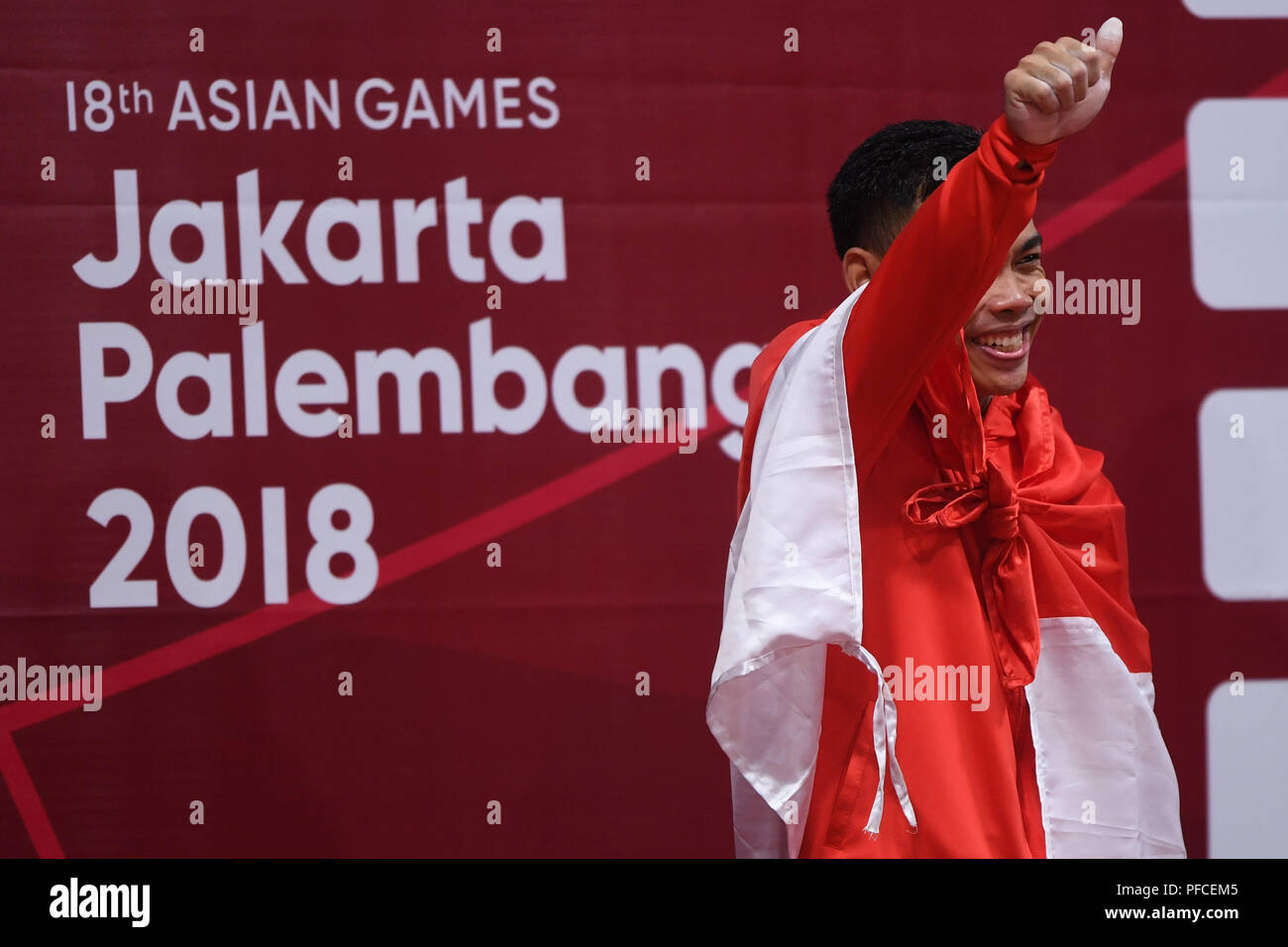 Jakarta, Indonesia. 21st Aug, 2018. Eko Yuli Irawan of Indonesia reacts ...
