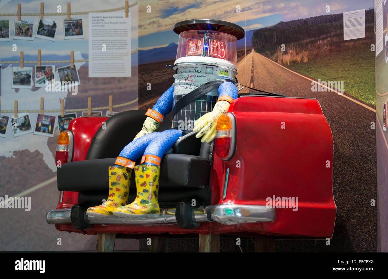 Paderborn, Germany. 20th Aug, 2018. The hitchhiking robot hitchBOT sits ...