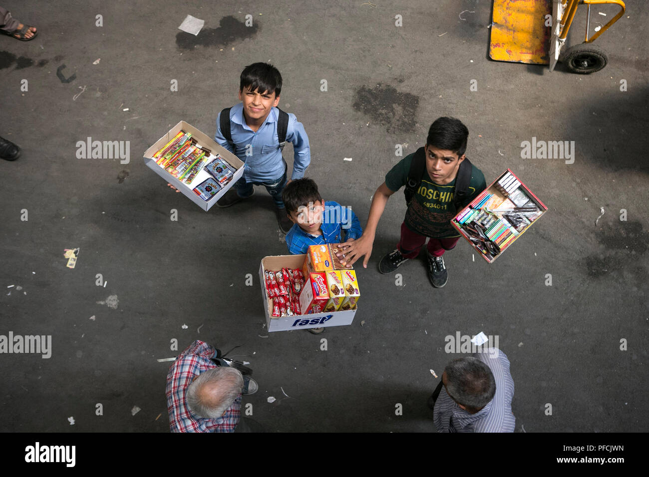 Tehran, Iran. 20th Aug, 2018. Iranian boys sells trinkets at the Grand ...