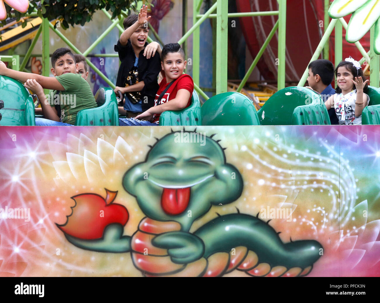 Beirut, Lebanon. 21st Aug, 2018. Children play at a playground to ...