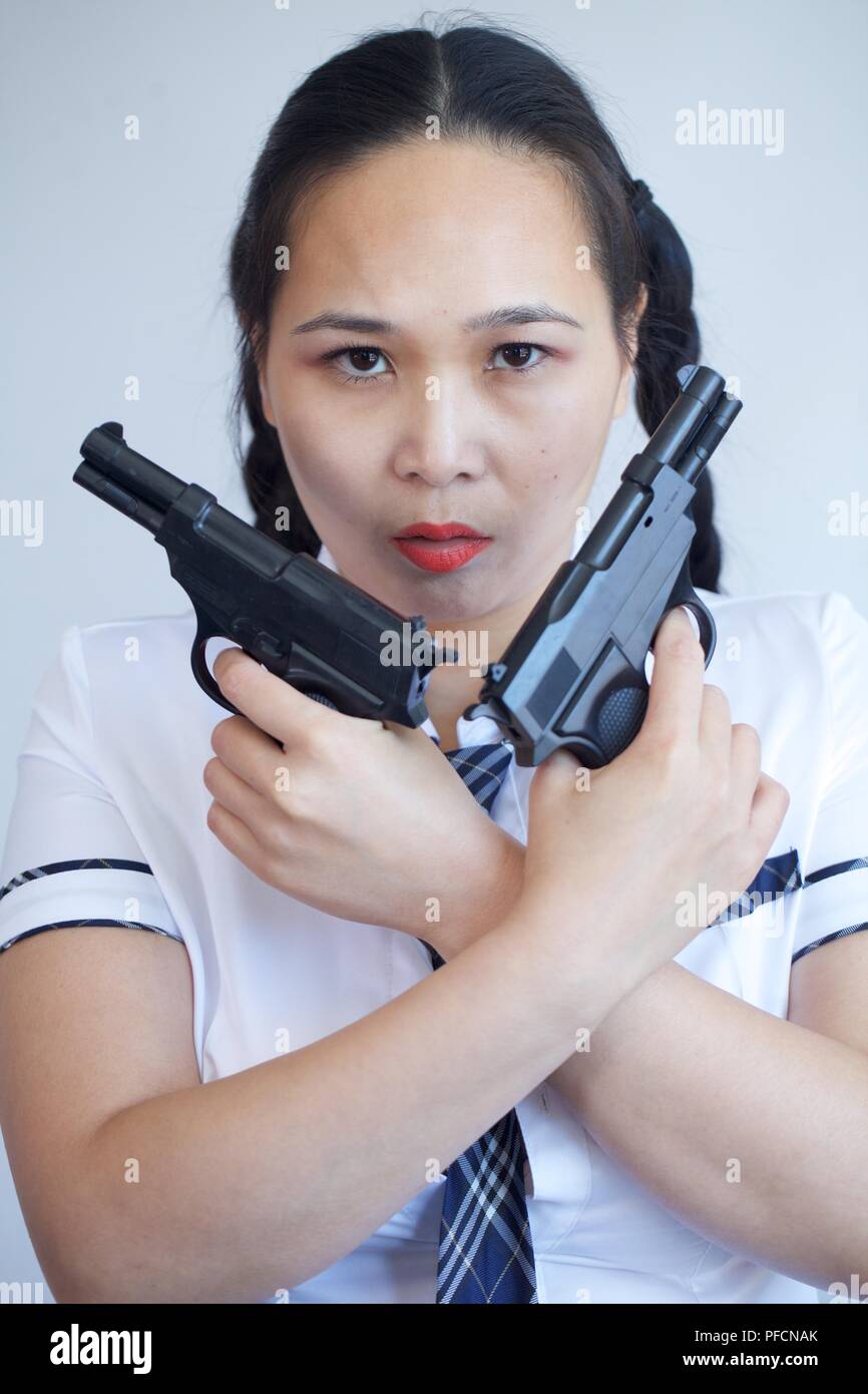 School girl with guns Stock Photo - Alamy