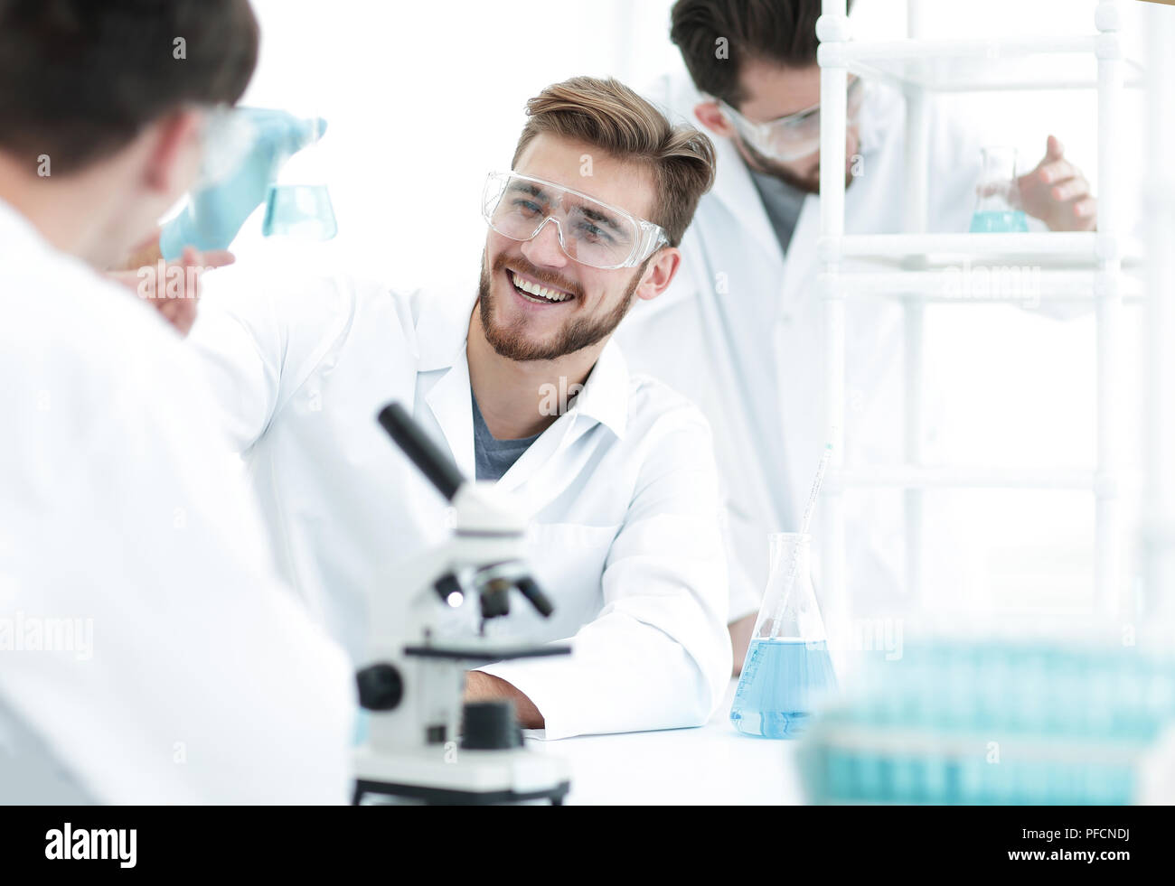 closeup.smiling team of biologists in the lab Stock Photo - Alamy