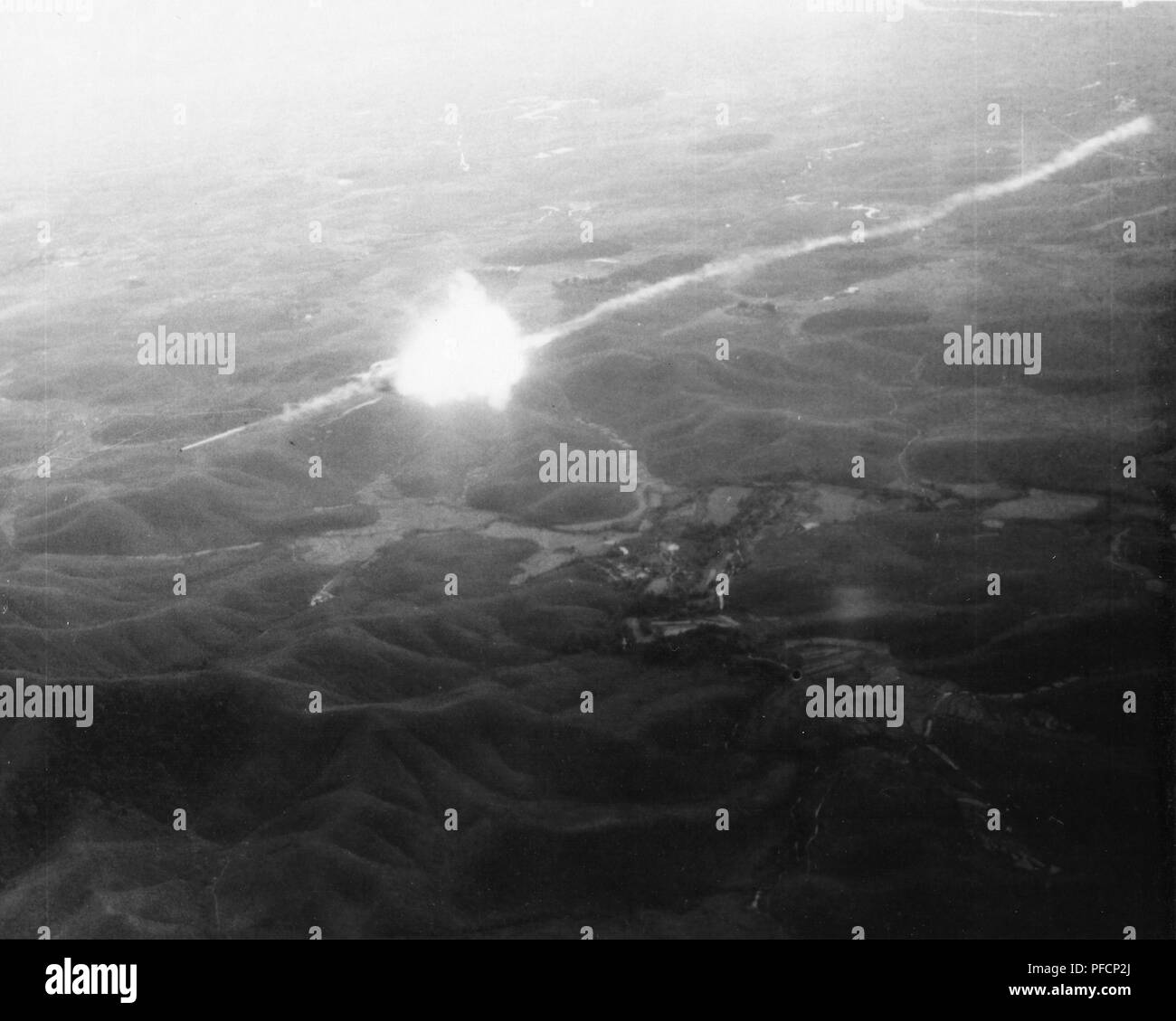 Aerial view of bomb exploding on a road in Vietnam during the Vietnam ...
