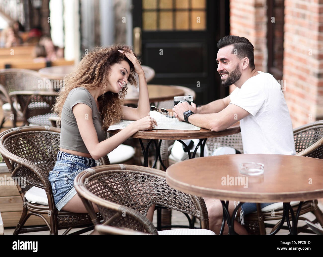Beautiful loving couple sitting in a cafe enjoying in coffee Stock ...