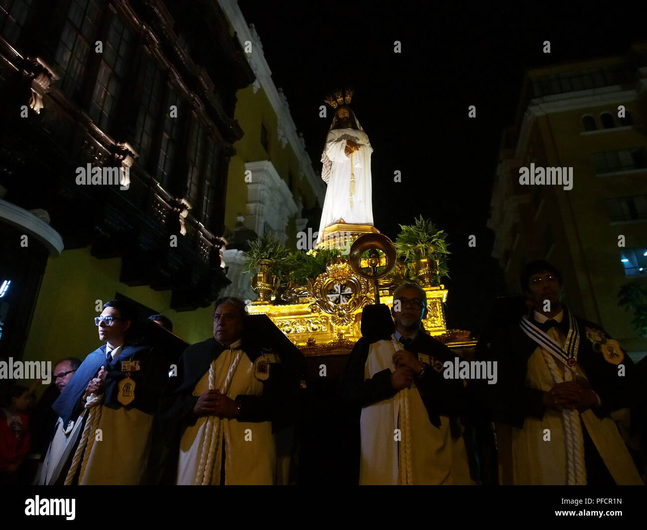 Devotees carrying on a religious procession at night called: "Steps of ...