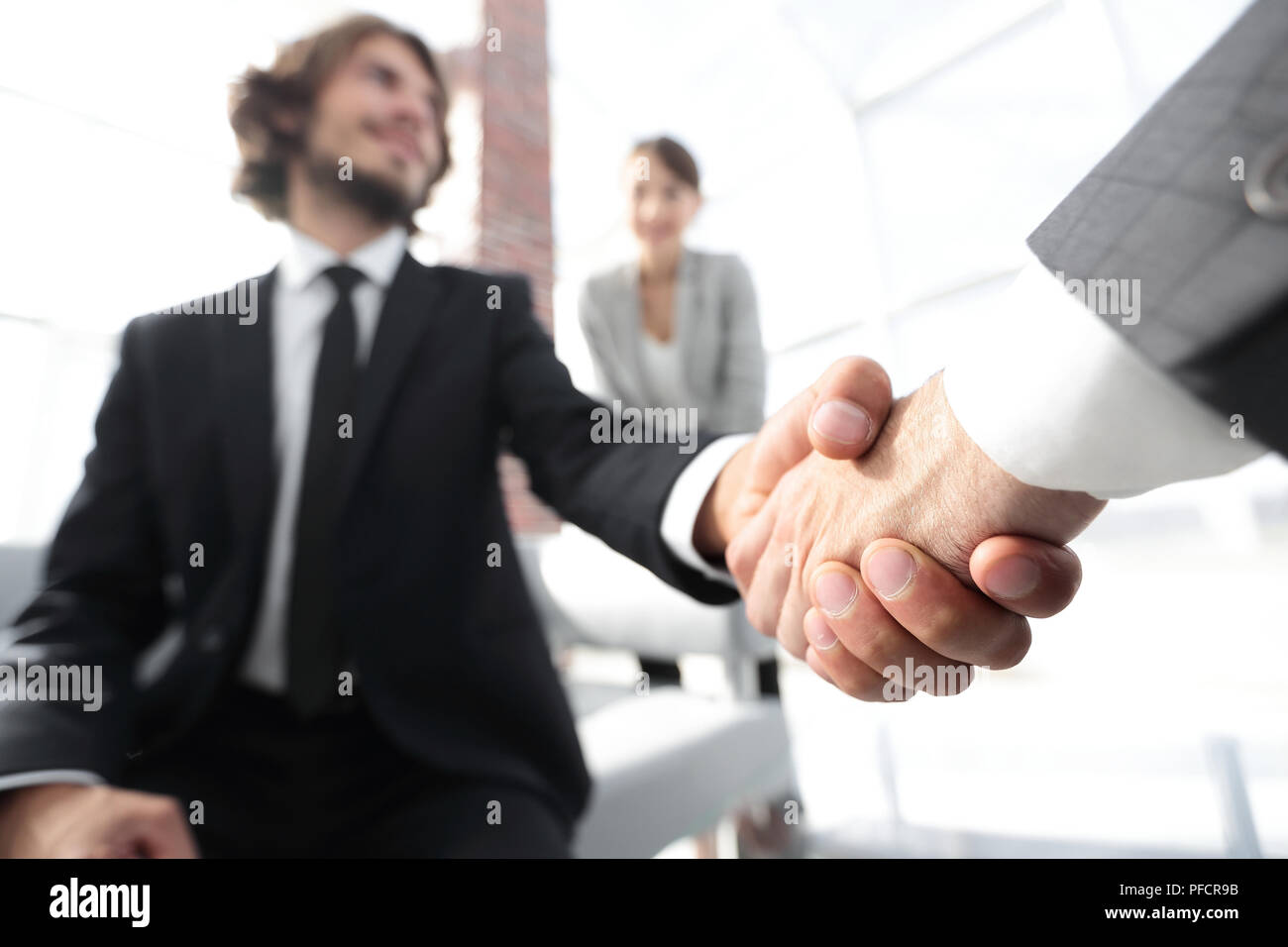 Closeup of a business hand shake Stock Photo - Alamy
