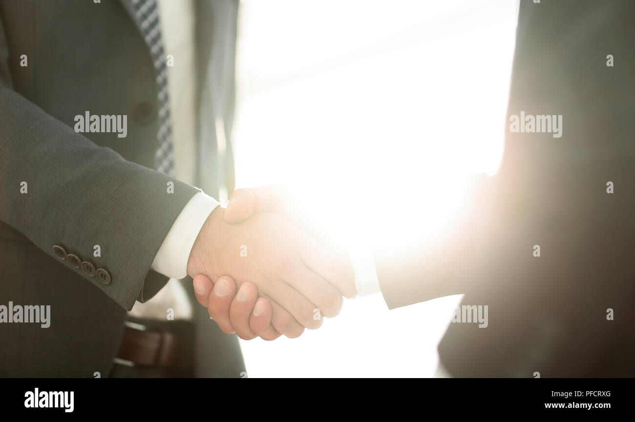 Businessman giving his hand for handshake to partner Stock Photo - Alamy