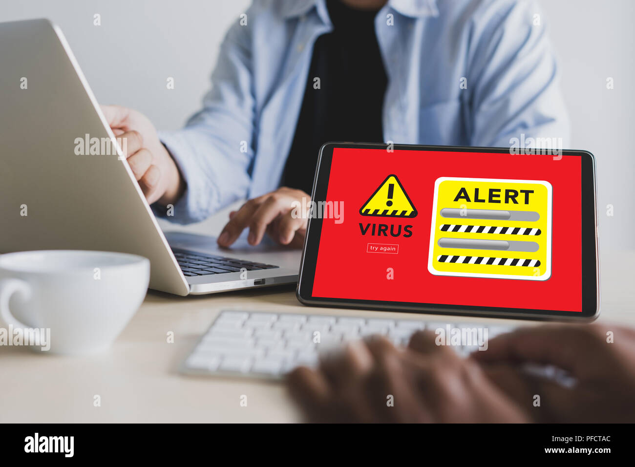 Hacker Protection Concept Man working on laptop Virus Detected Alert ...