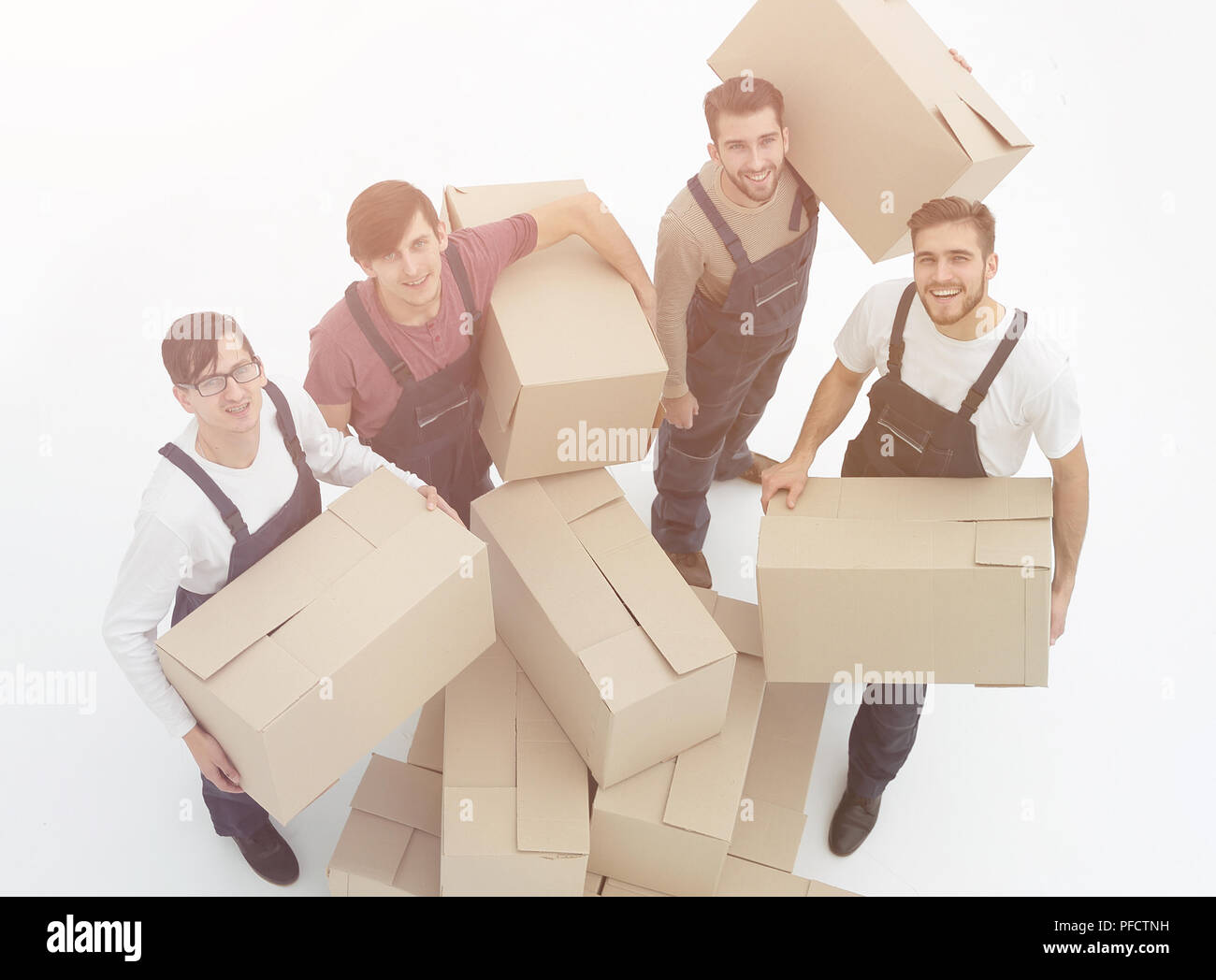 Delivery men with cardboard boxes on white background Stock Photo - Alamy