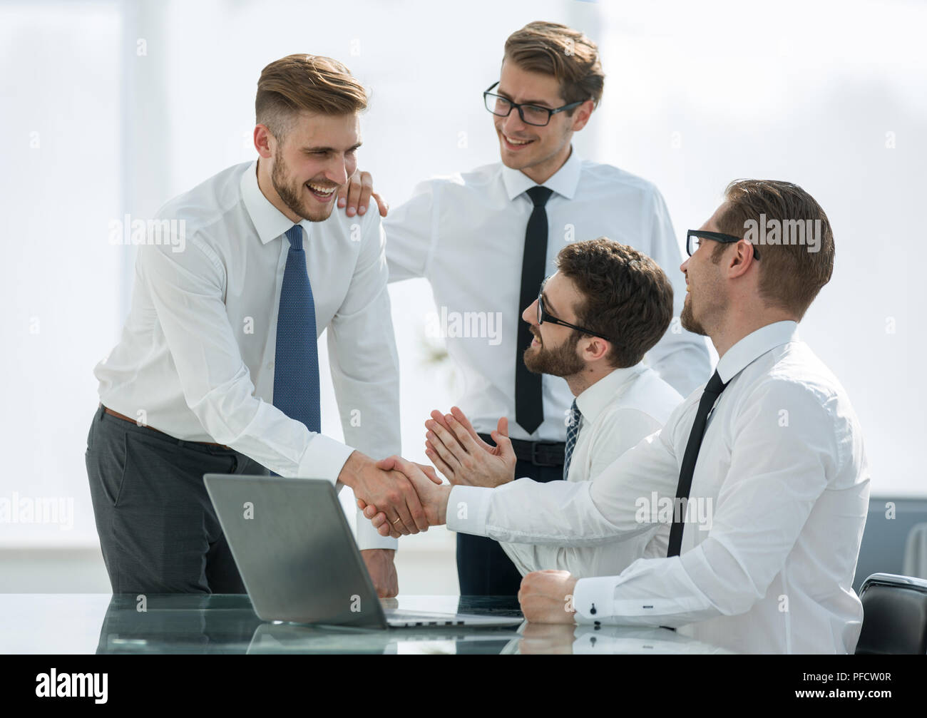 welcome handshake employees in the workplace Stock Photo - Alamy