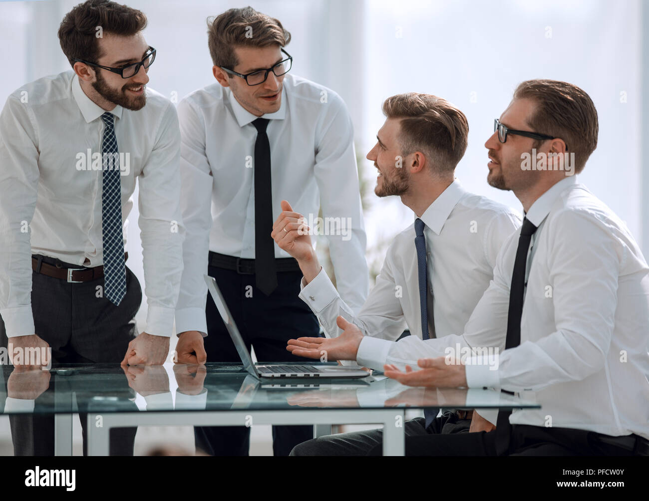 group of employees discussing work issues Stock Photo - Alamy