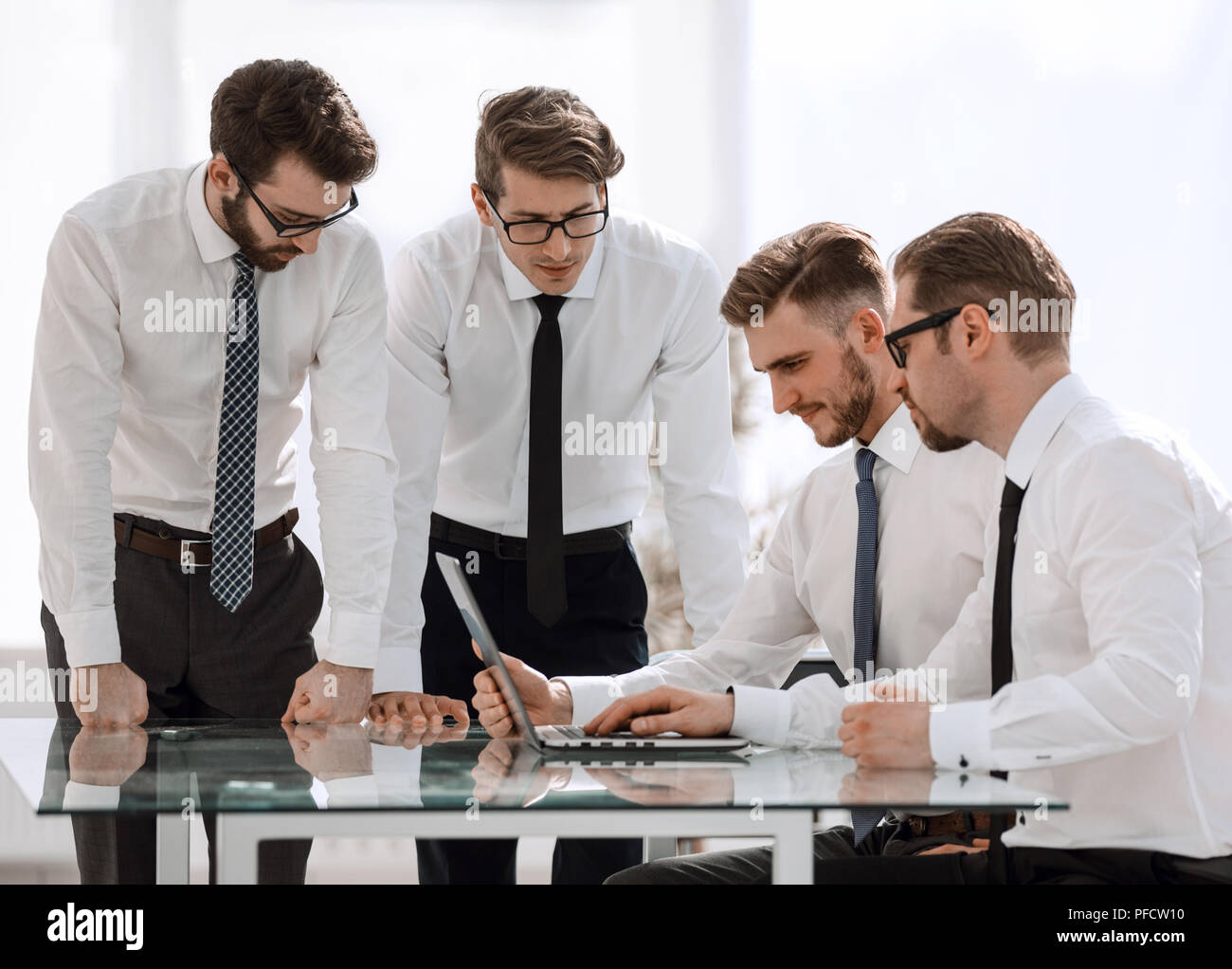 group of employees discussing the incoming information Stock Photo - Alamy