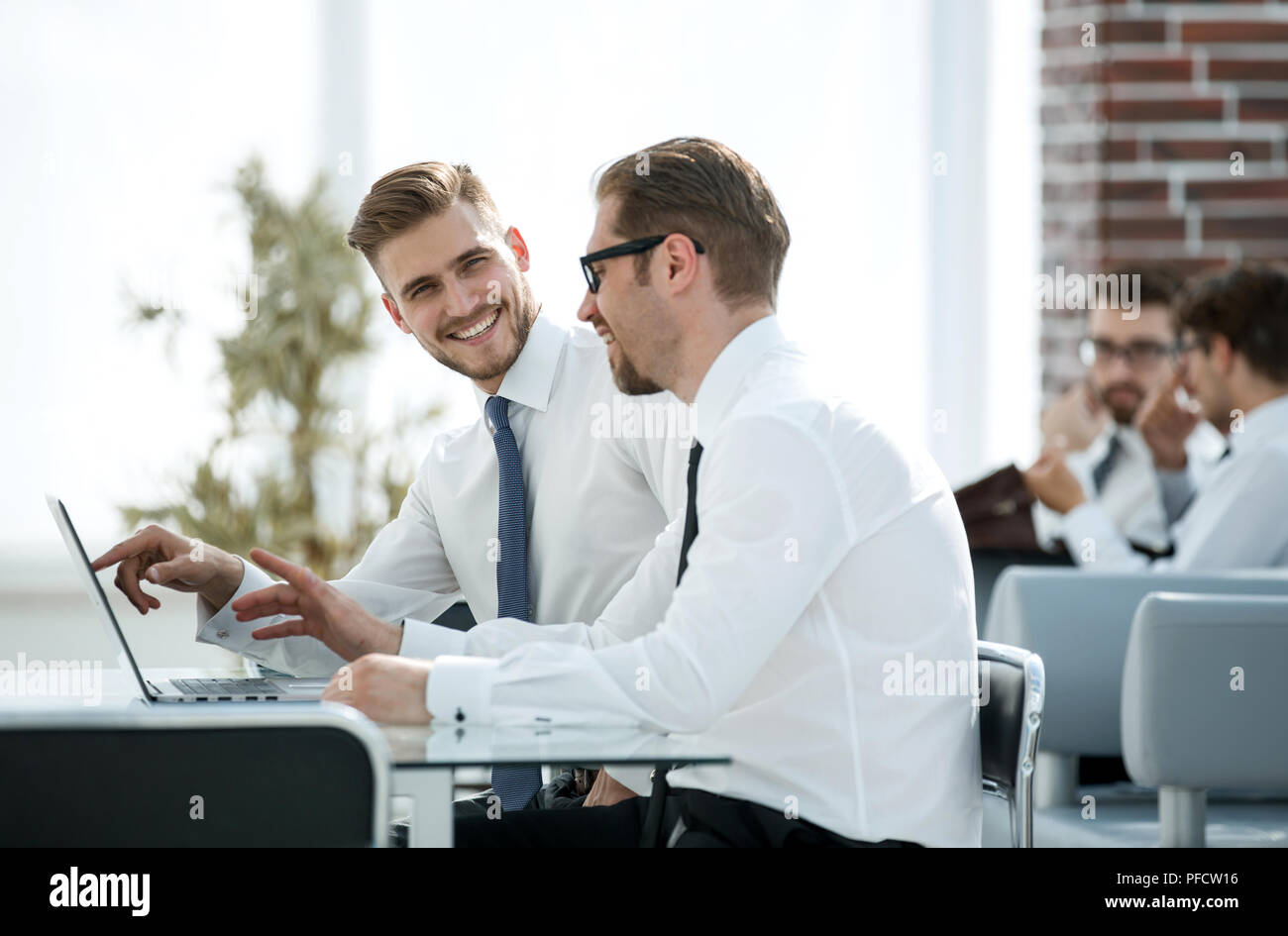 employees discussing new information Stock Photo - Alamy
