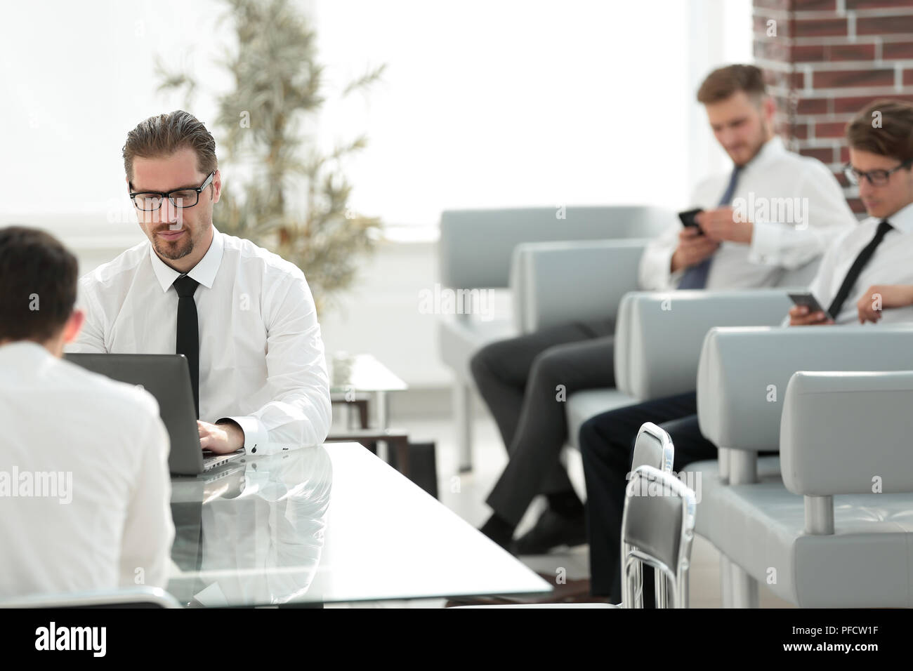 group of employees in the workplace in the office Stock Photo - Alamy
