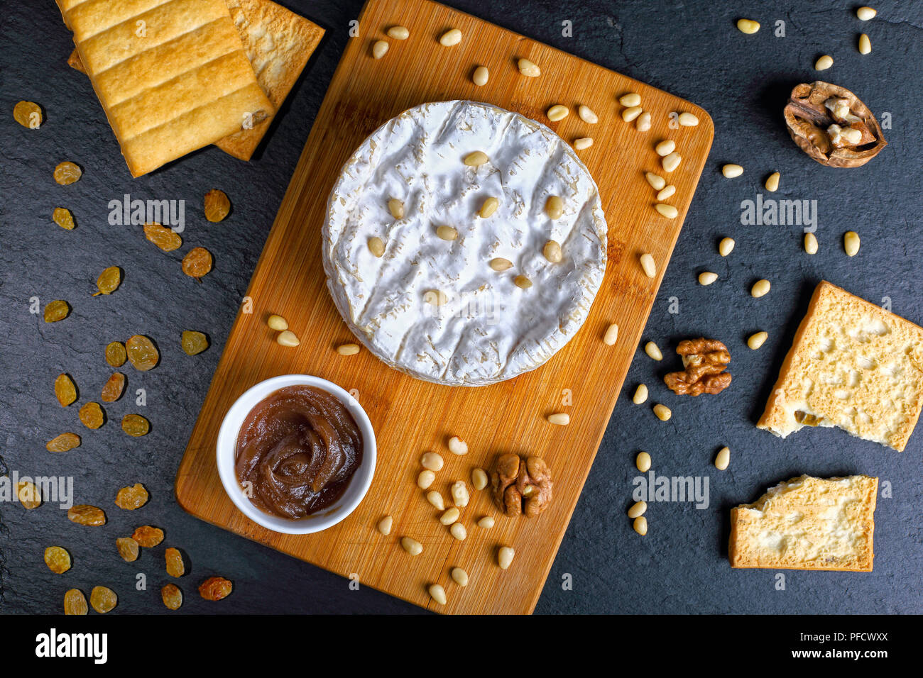 soft, creamy, surface-ripened cow's milk cheese Camembert on wooden ...