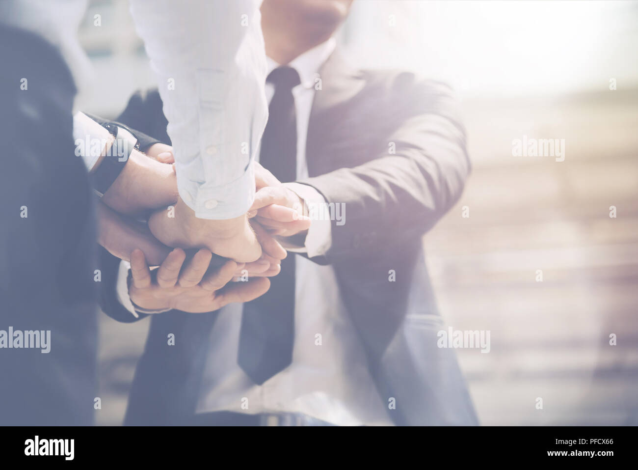 business people team showing unity with their hands together expose the ...