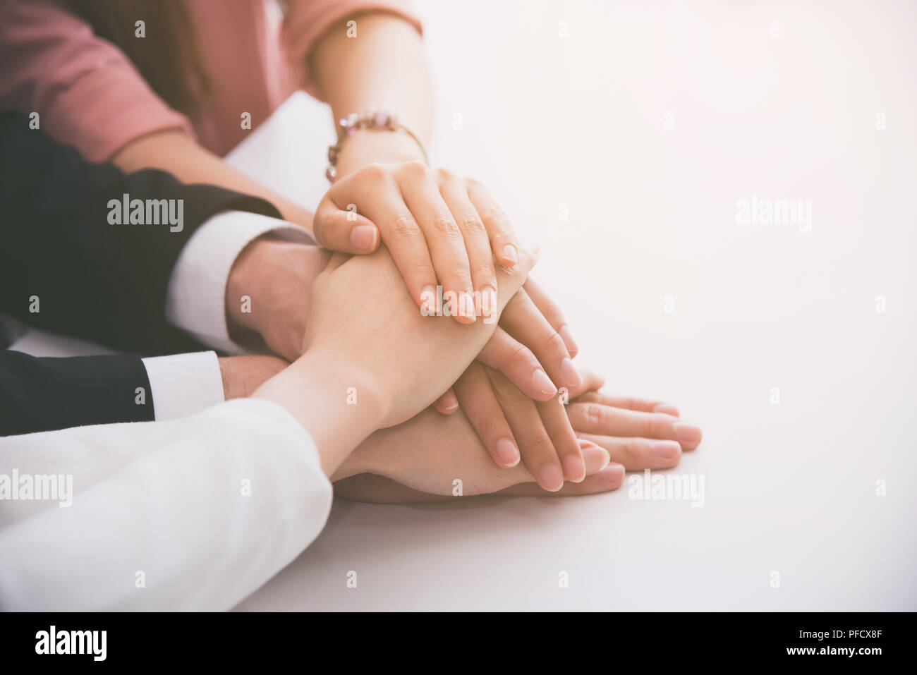 business people team showing unity with their hands together expose the ...