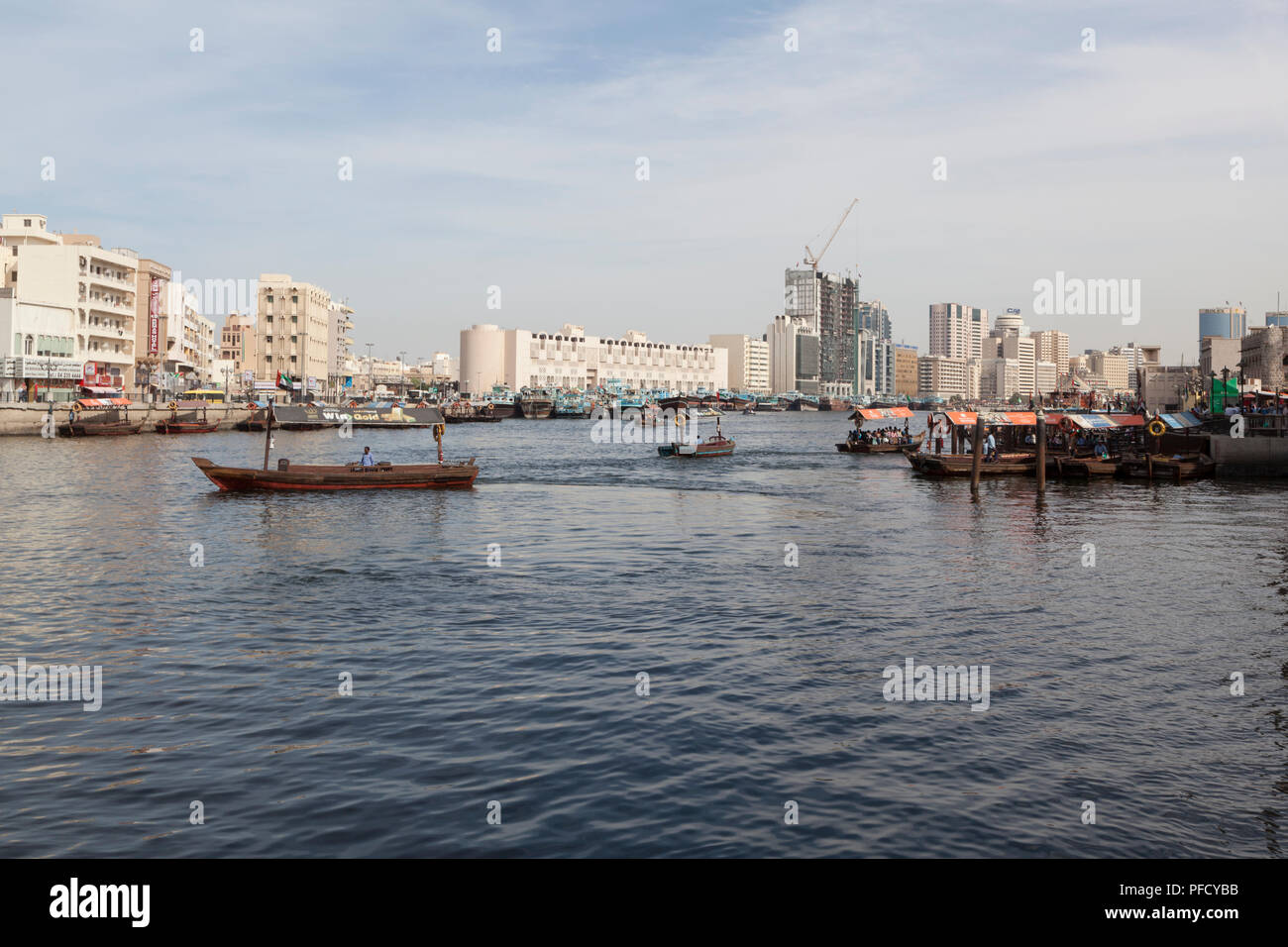Abra and dhow boats on the Dubai Creek, UAE Stock Photo - Alamy