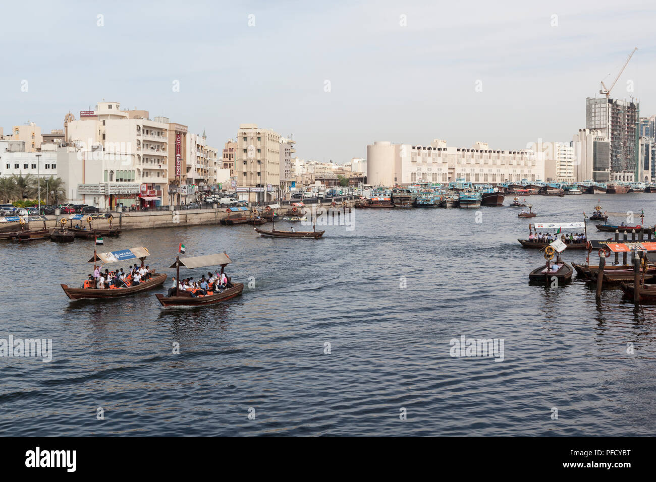 Abra and dhow boats on the Dubai Creek, UAE Stock Photo - Alamy