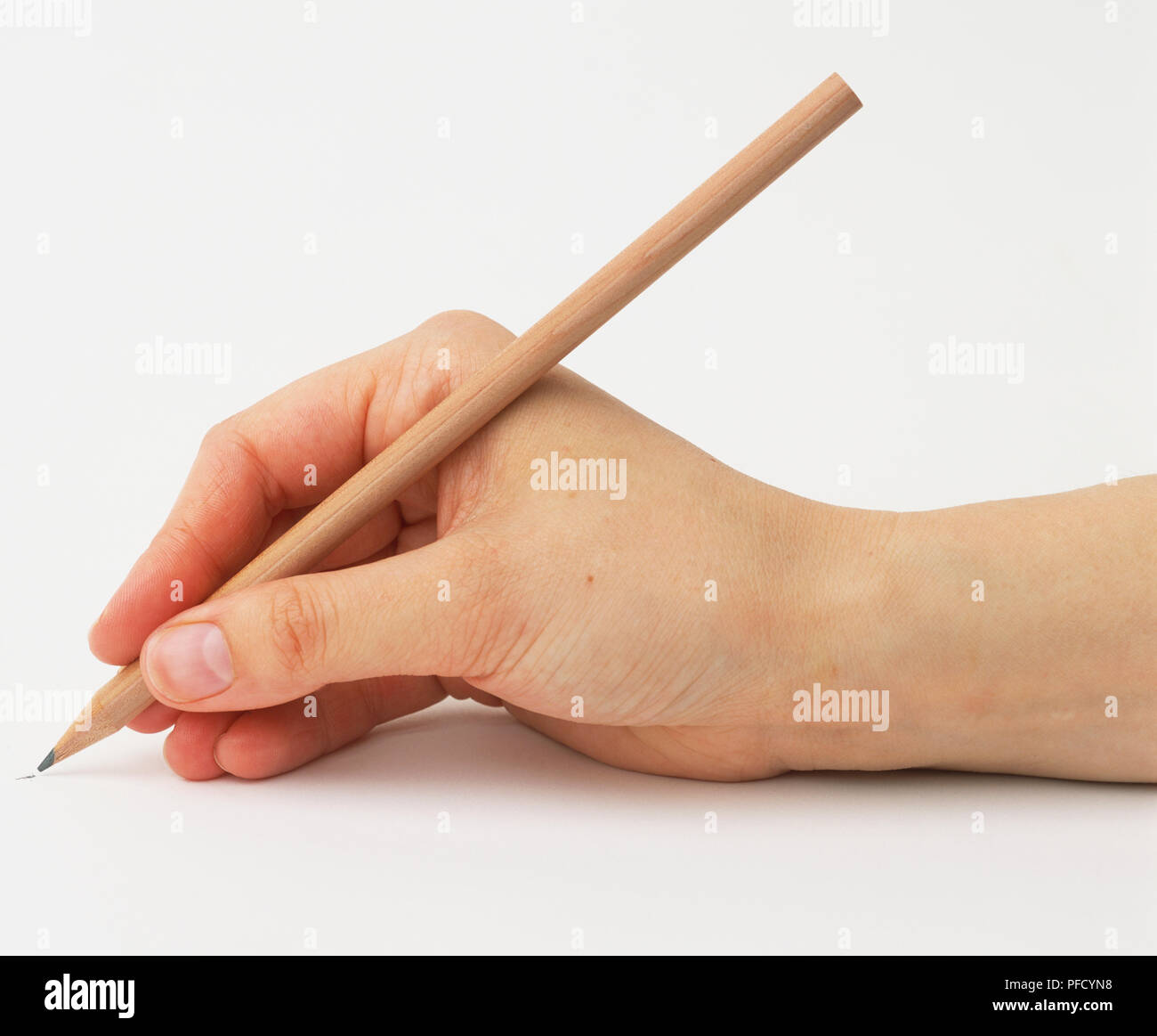 Hand holding a pencil, side view Stock Photo - Alamy