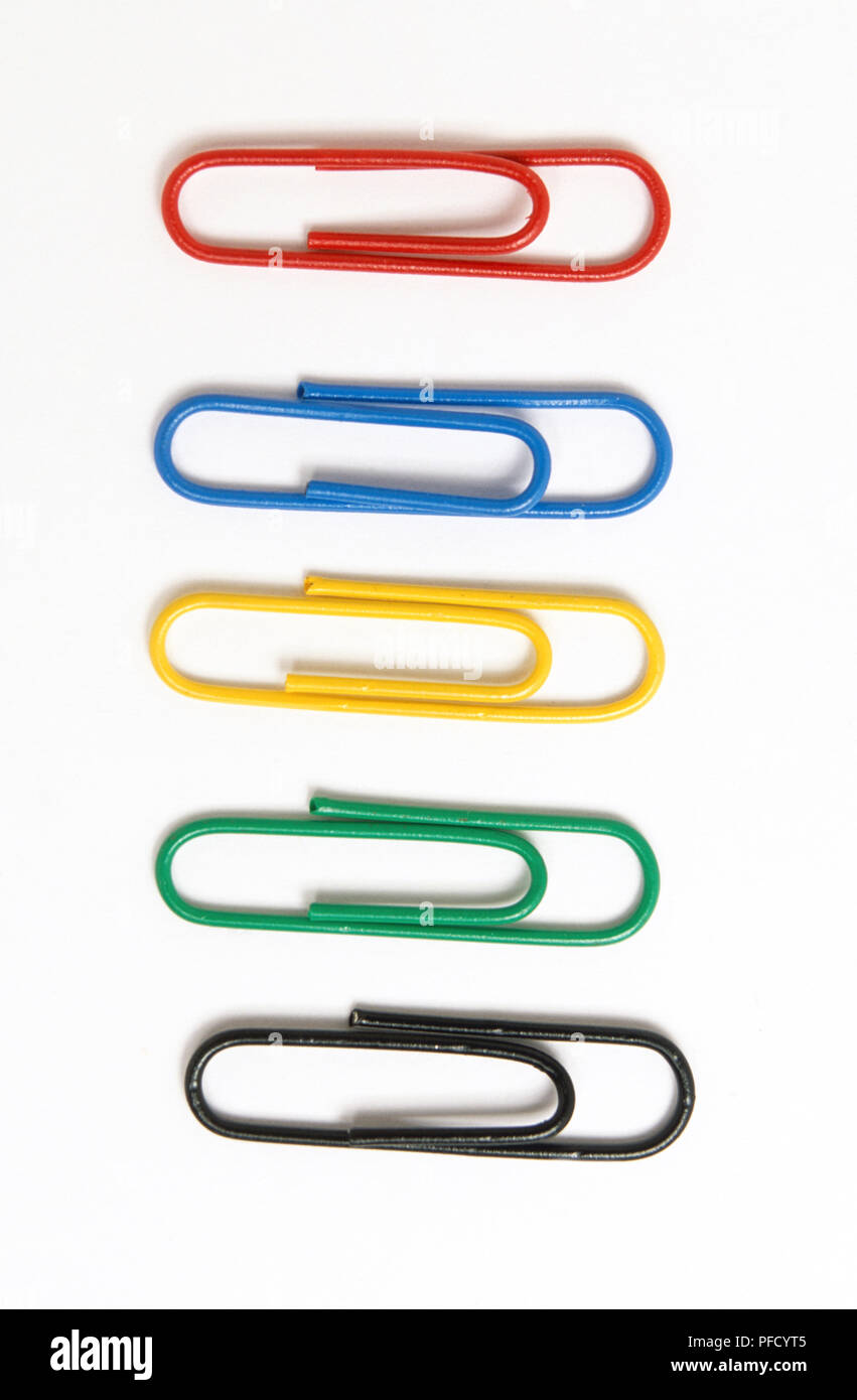 Multi-coloured paper clips arranged in a row Stock Photo - Alamy