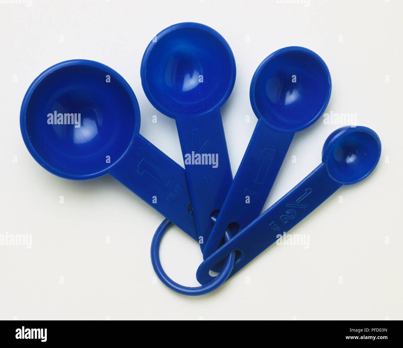 Blue plastic measuring spoon set on a ring, close up Stock Photo - Alamy