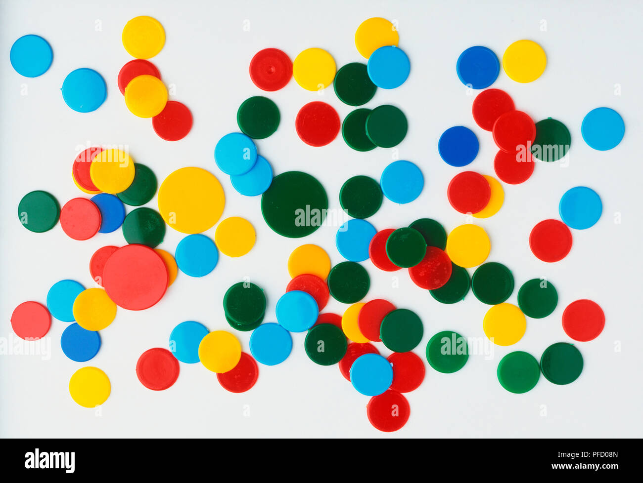 Colourful plastic discs used in tiddlywinks, front view Stock Photo - Alamy