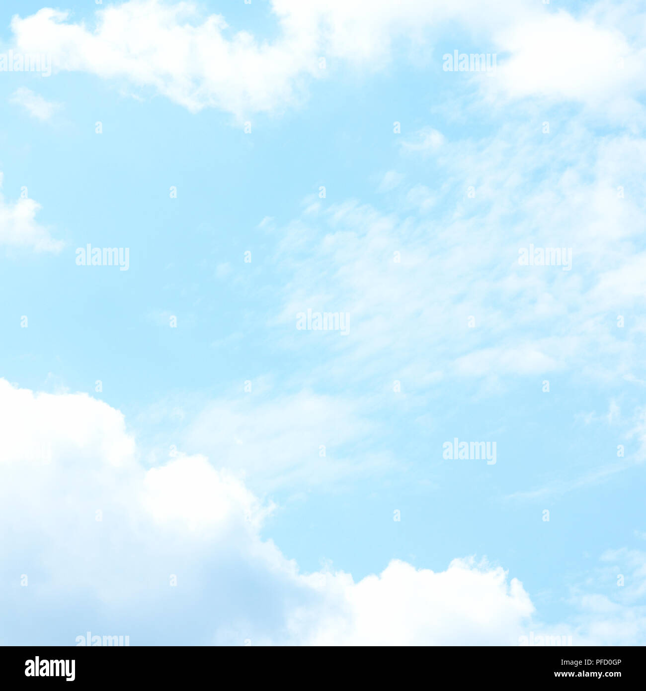 Blue sky with wispy clouds Stock Photo - Alamy