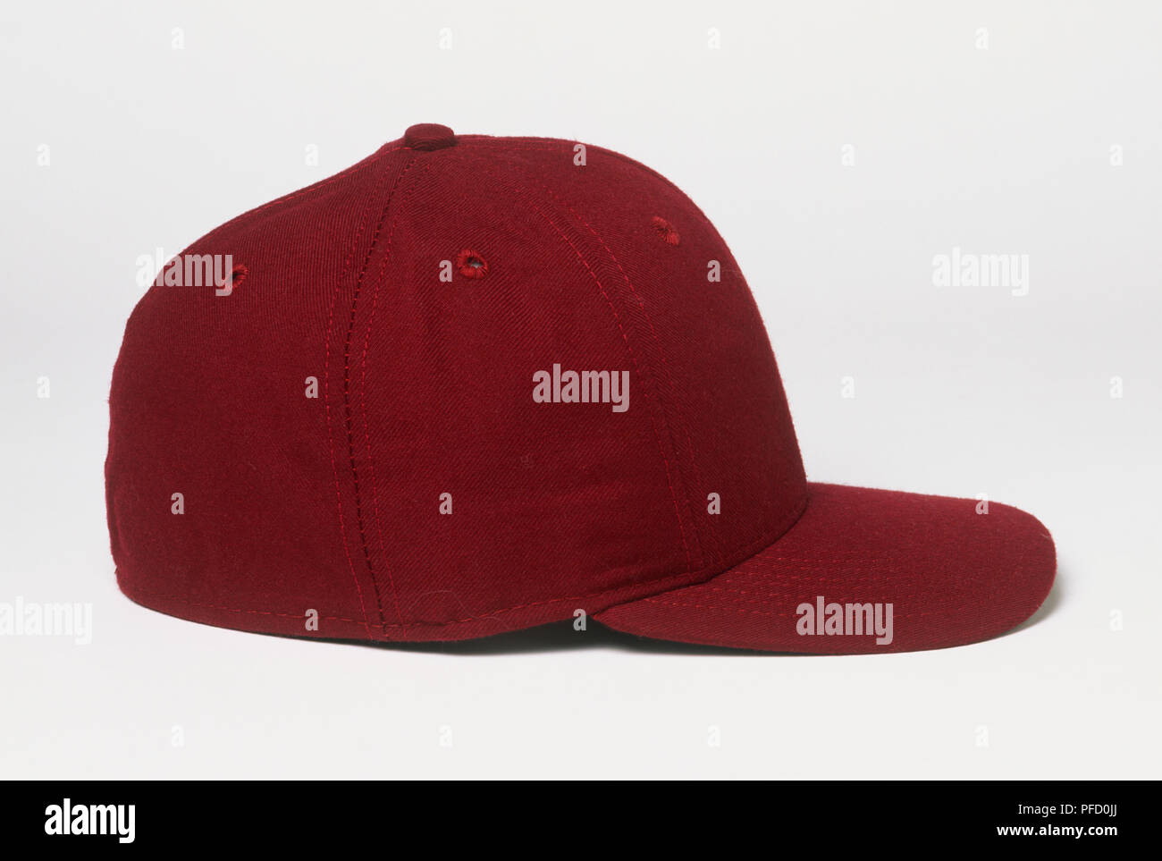 Red baseball cap, side view Stock Photo - Alamy