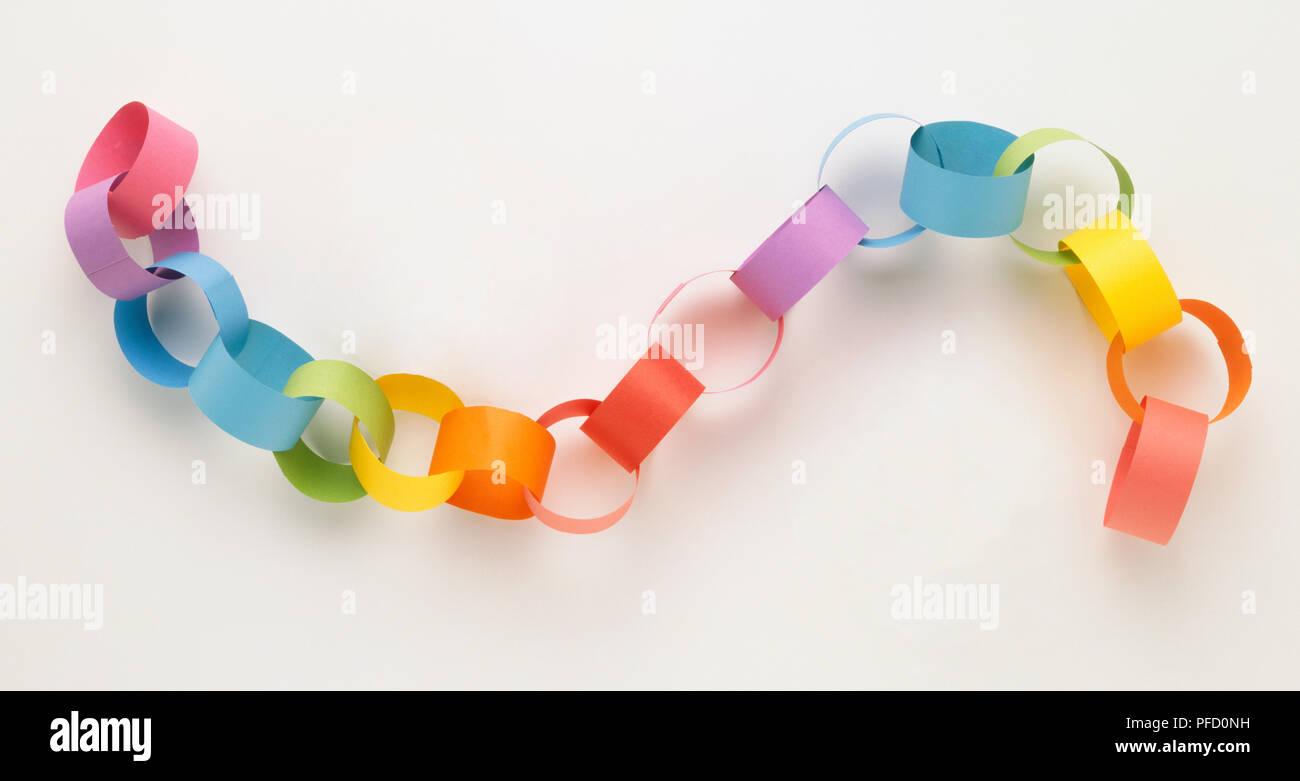 Colourful paper chain and two paper rosettes Stock Photo - Alamy