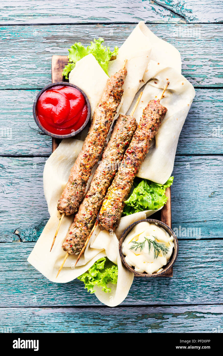 Turkish traditional dish meat kebab with herbs and spices.Caucasian ...