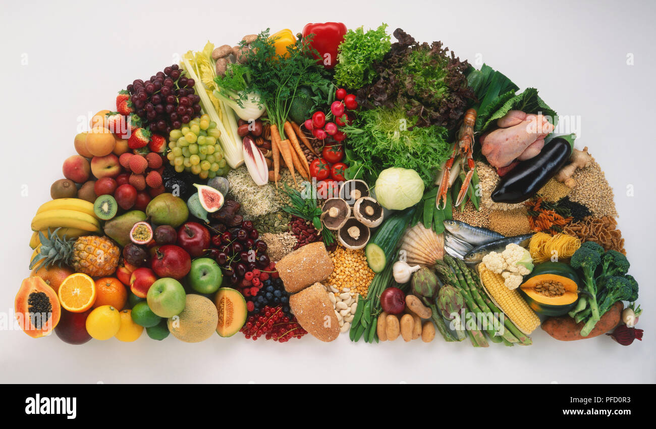 Large selection of fresh produce arranged in semi-circle, view from ...