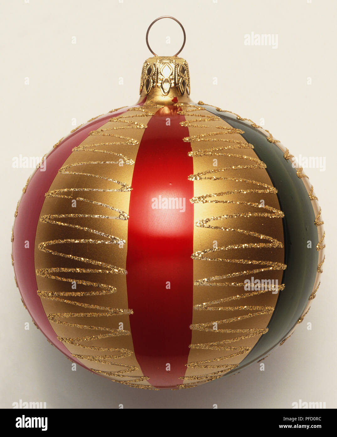 Metallic golden bauble with green and red sections Stock Photo - Alamy