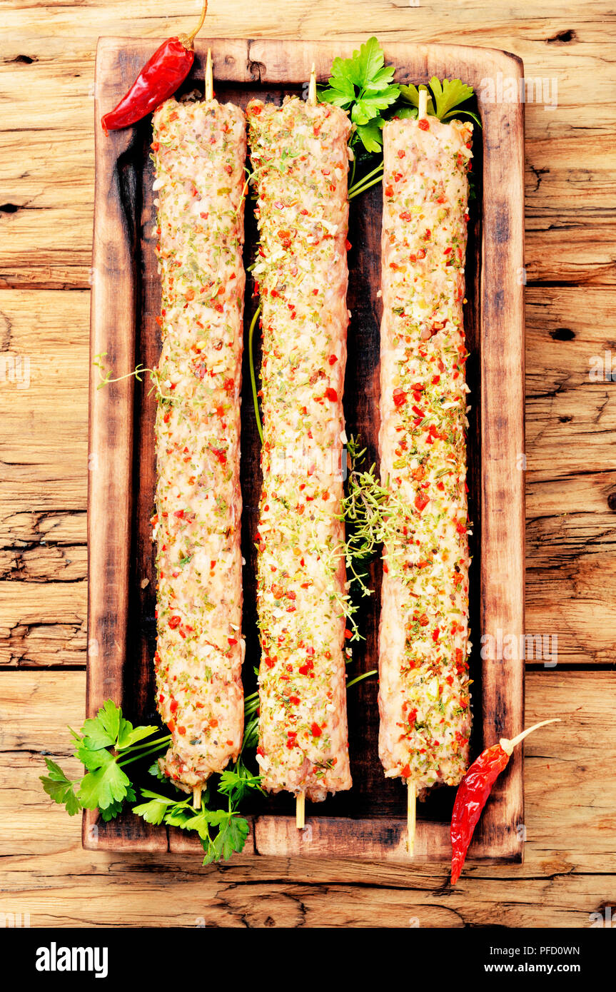 Turkish traditional dish meat kebab with herbs and spices.Caucasian ...