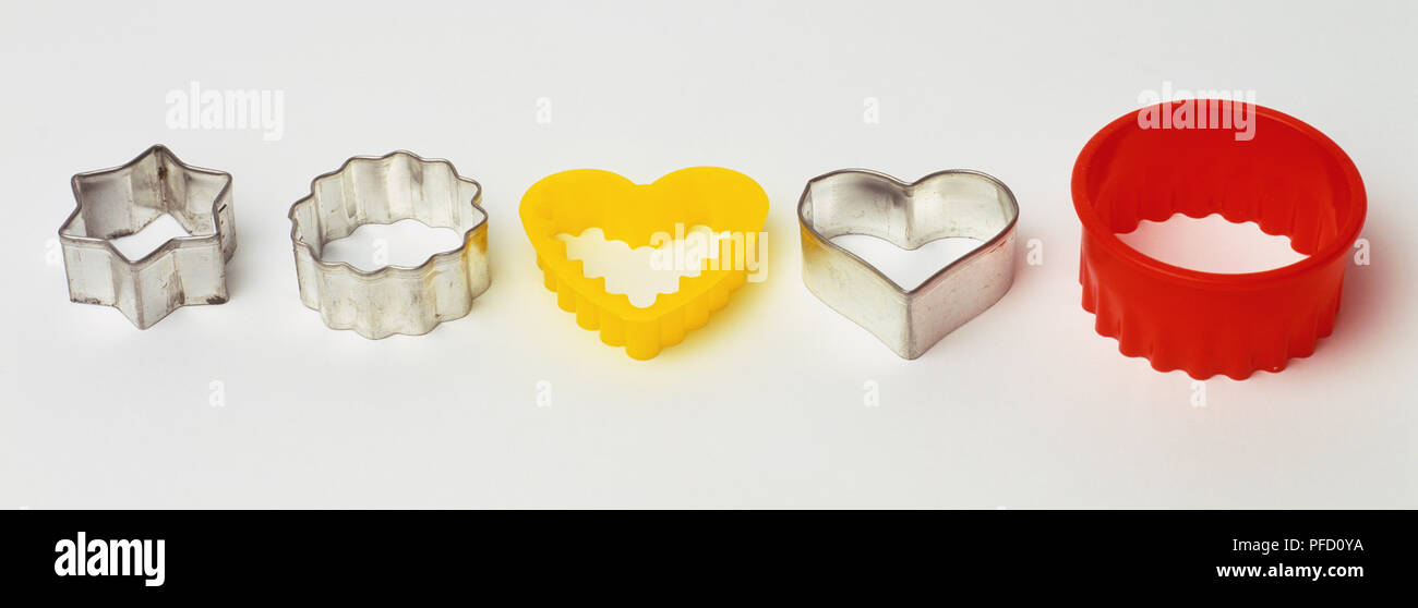 Selection of differently shaped plastic and metal pastry cutters ...