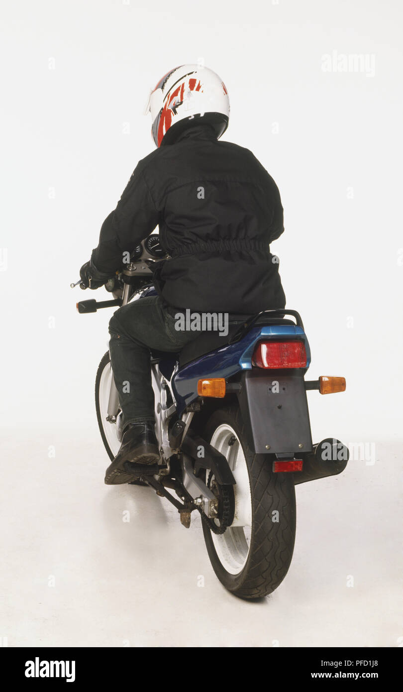 Motorbike and rider, rear and side view Stock Photo - Alamy