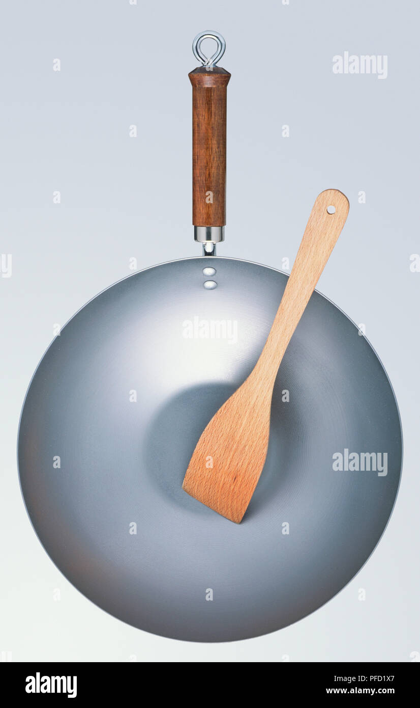 Wok with wooden spoon inside, view from above Stock Photo - Alamy