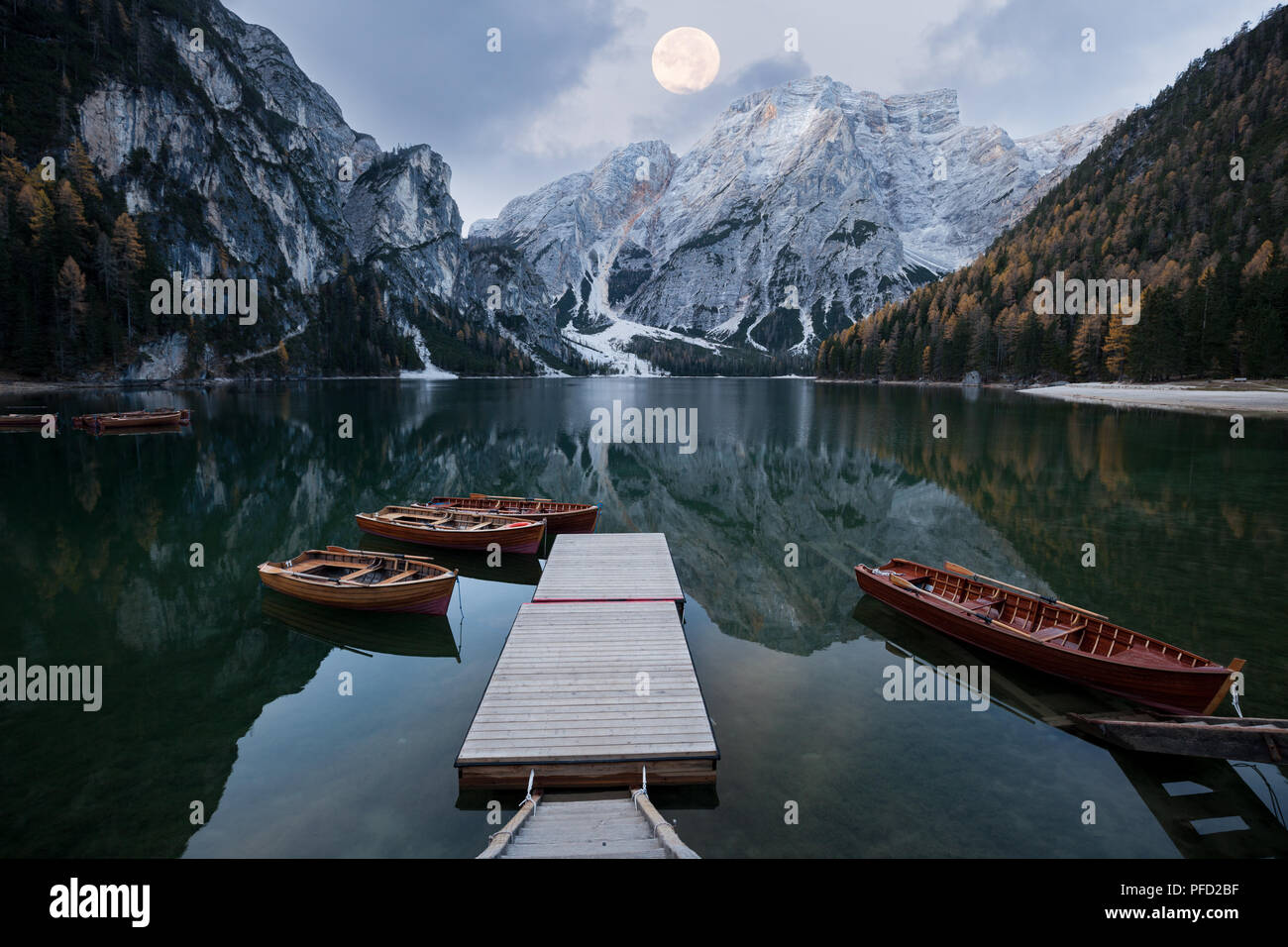 Full moon over alpine mountain lake. Lago di Braies, Dolomites Alps ...