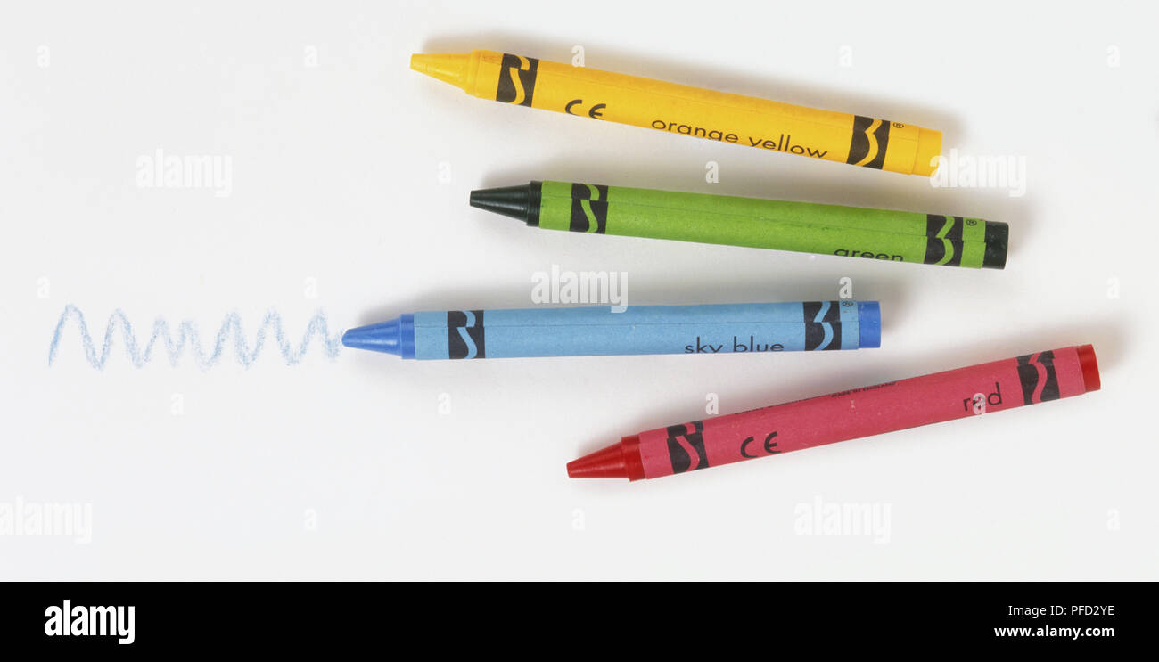 Four coloured wax crayons, red, blue, green and yellow, close up Stock ...