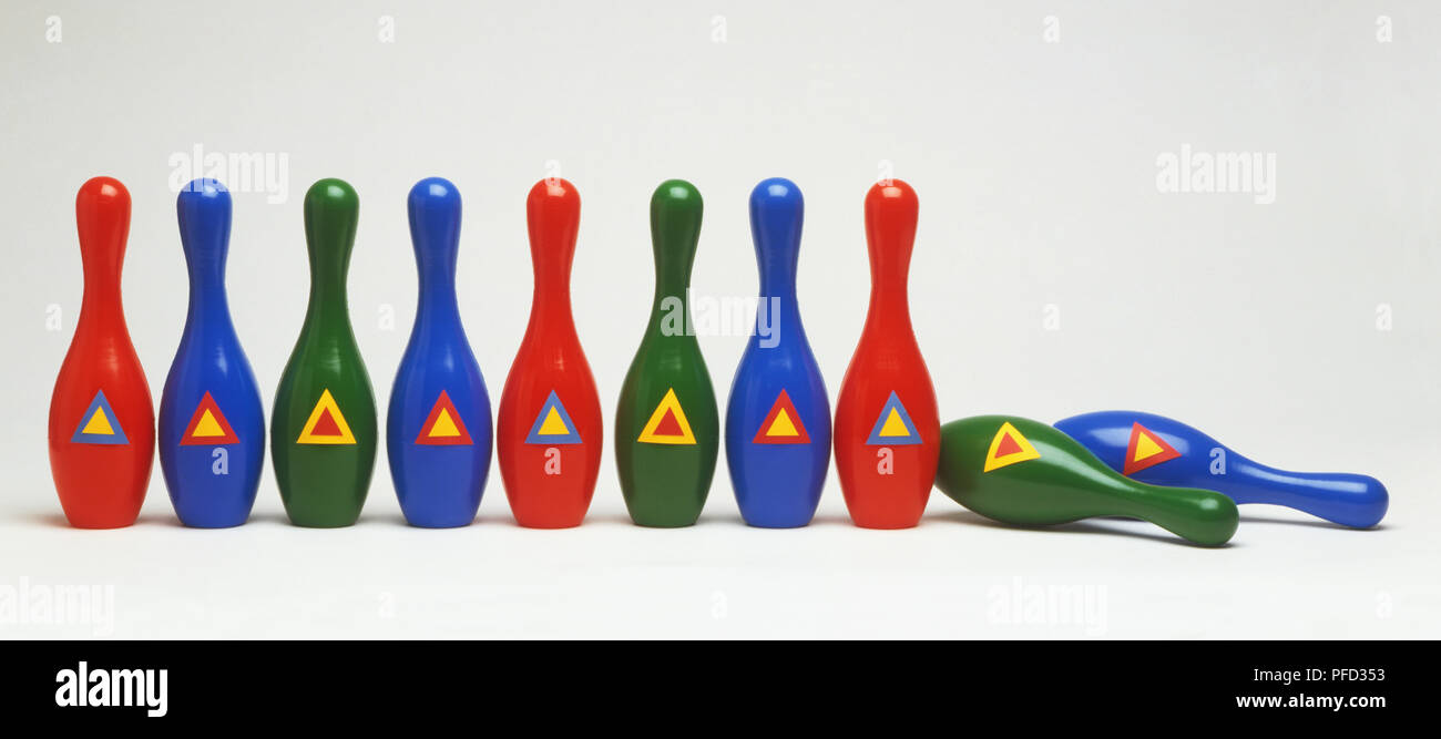Ten bowling pins, two of them knocked over Stock Photo - Alamy