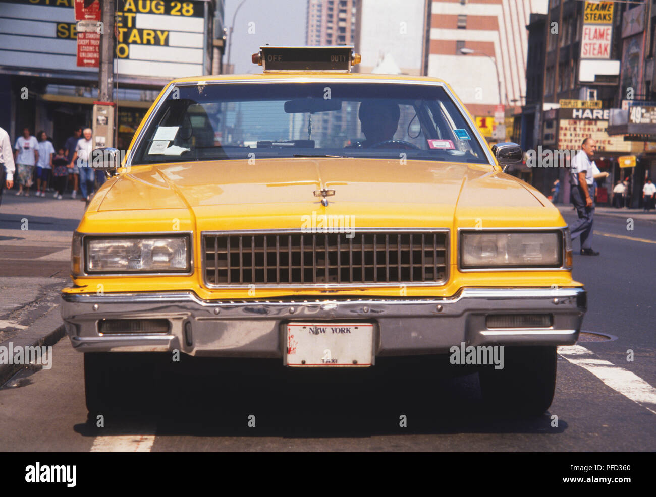 USA, New York City, yellow taxi in the street, front view Stock Photo ...