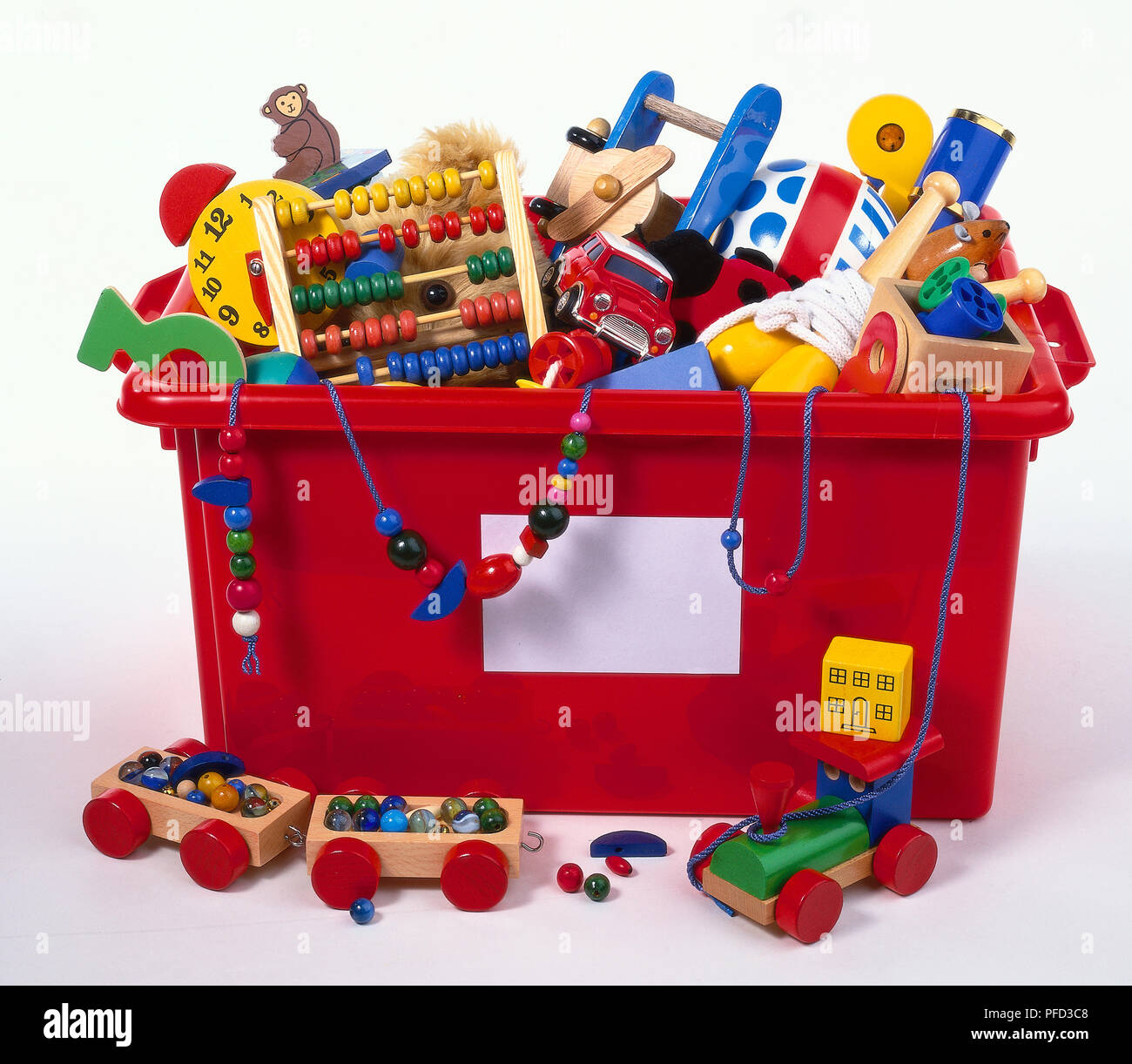 Red, plastic box of toys Stock Photo - Alamy