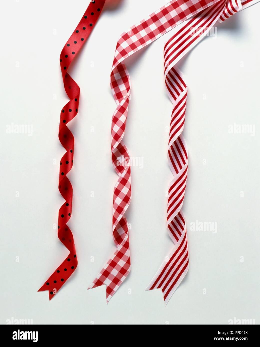Three red ribbons, spotted, gingham and striped Stock Photo - Alamy